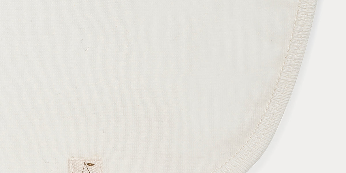 Bavoir Pebio lait blanc • Bonpoint